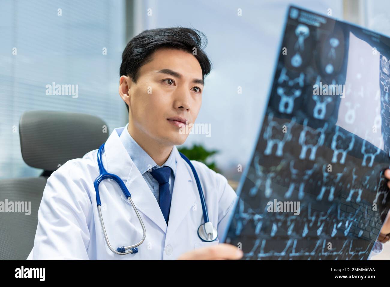 The young doctor to see x-rays Stock Photo - Alamy