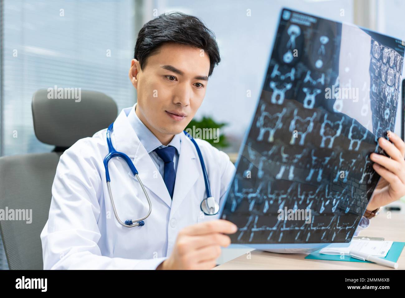The young doctor to see x-rays Stock Photo - Alamy