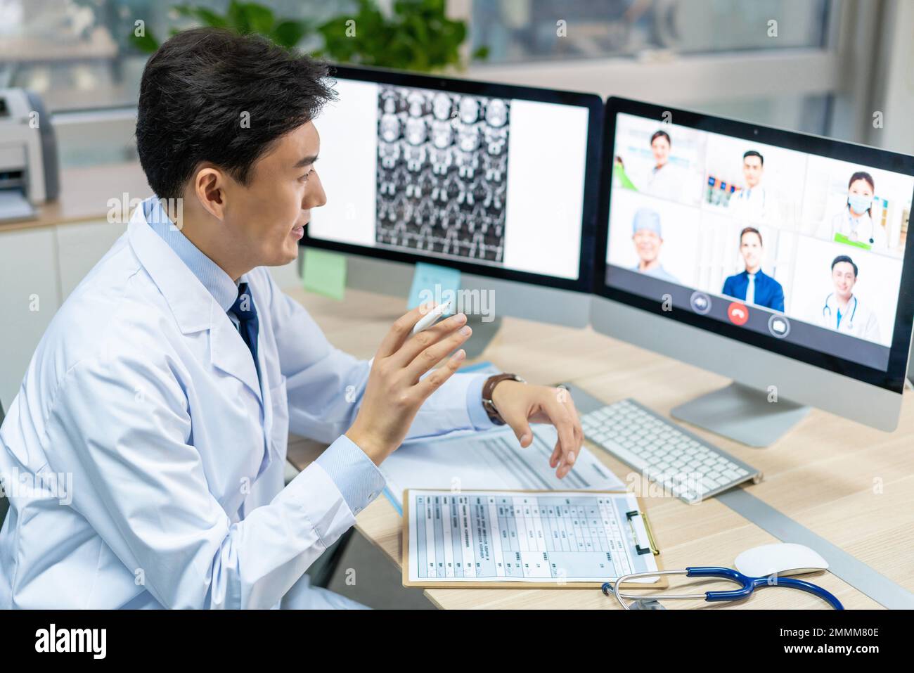 The young doctor working in the office Stock Photo - Alamy