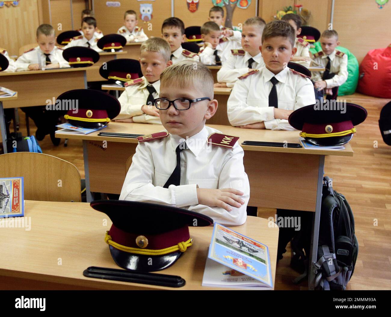 Young cadets listen to their teacher during the first lesson in a cadet ...