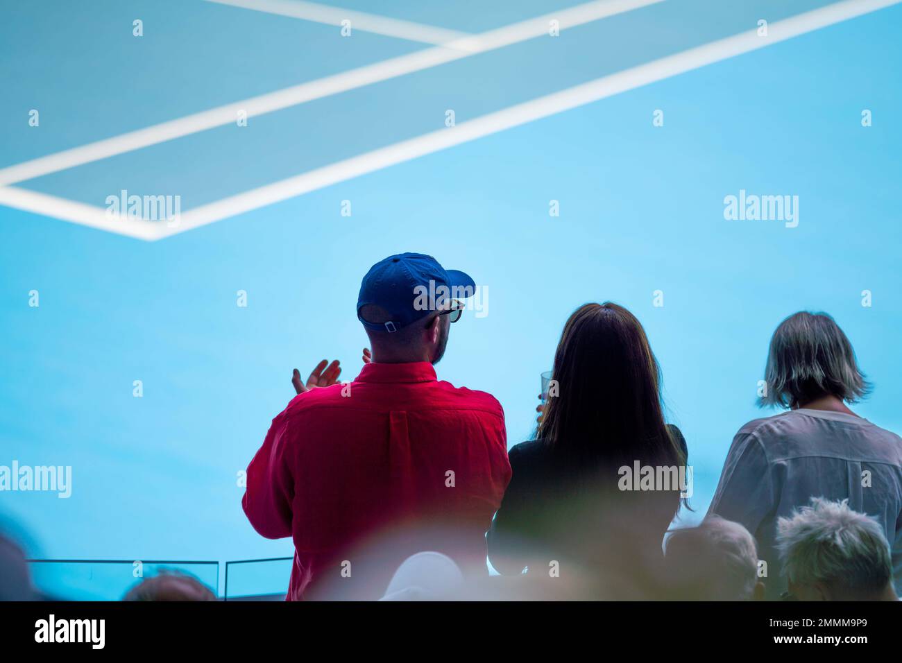 fans watching a sporting match and sporting event in a stadium in ...