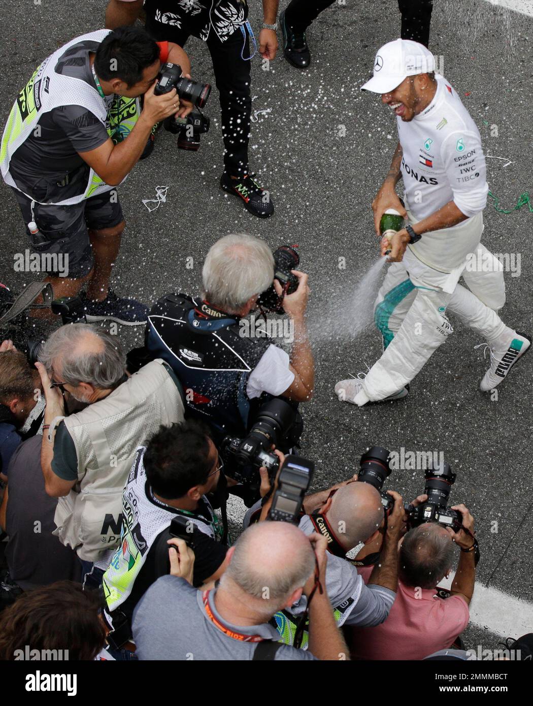 Mercedes driver Lewis Hamilton of Britain celebrates spraying champagne ...