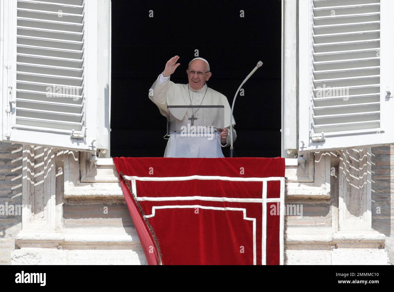 Pope Francis recites the Angelus noon prayer from the window of his ...