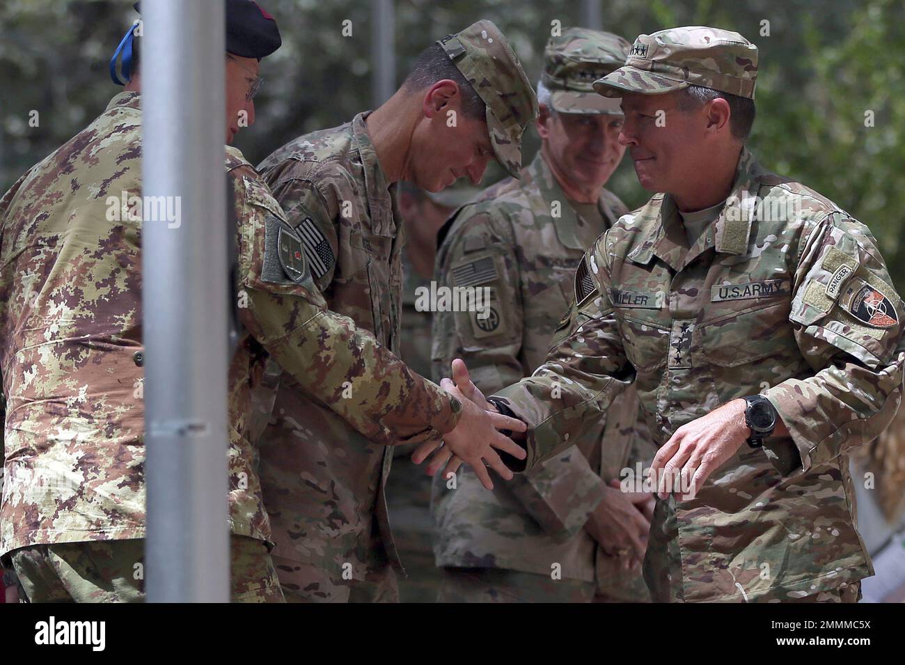 Incoming U.S. Army Gen. Austin Miller, right, shakes hands with Gen ...