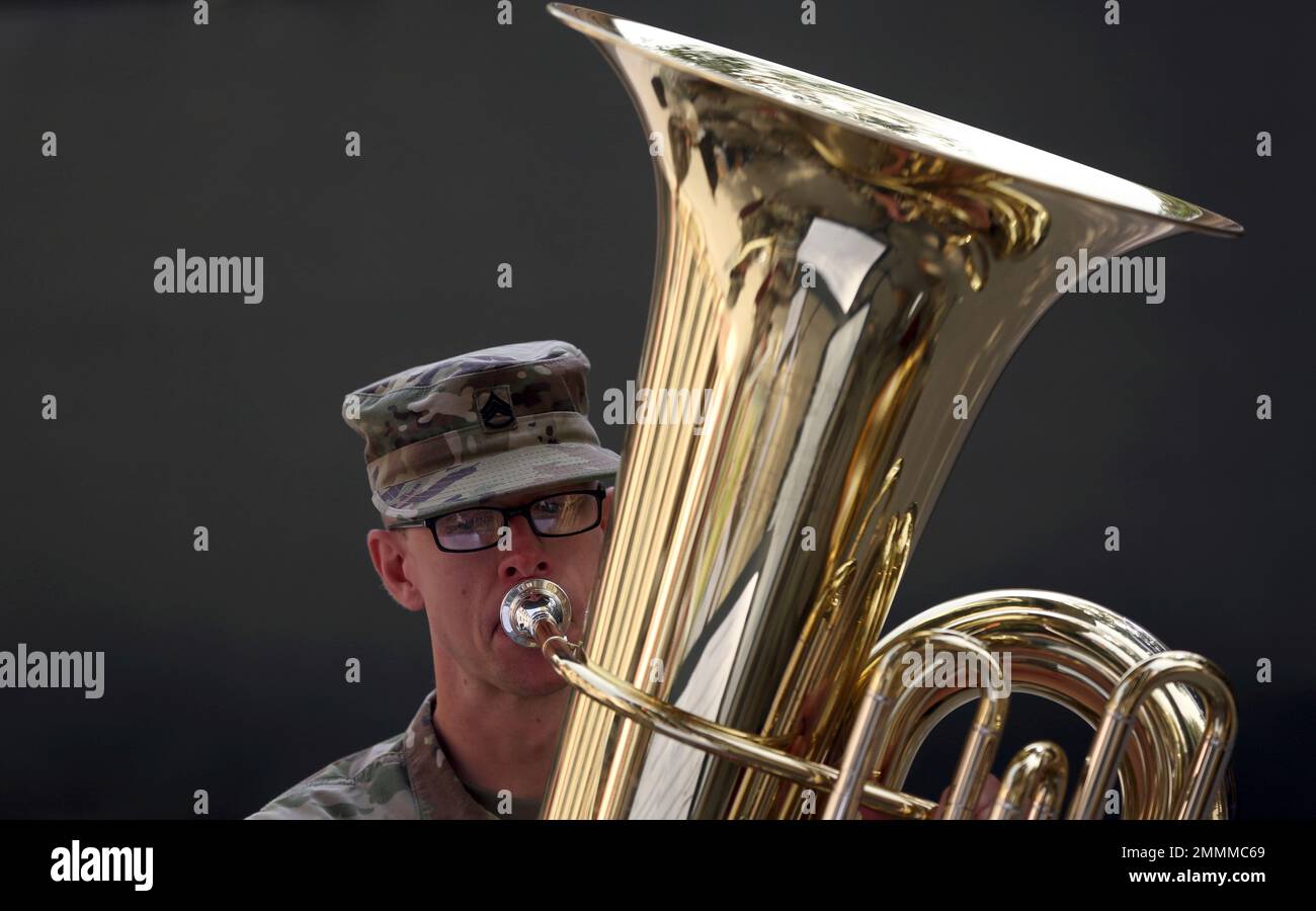 A U.S. Army soldier plays the trumpet during the change of command ...