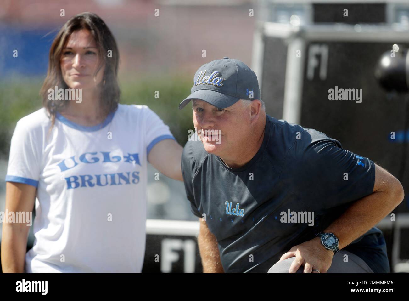 UCLA head coach Chip Kelly, right, talks to his girlfriend Jill Cohen ...