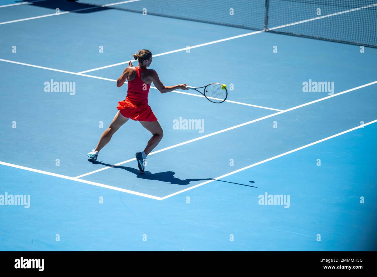 tennis fan watching a tennis match at the australian open eating food ...
