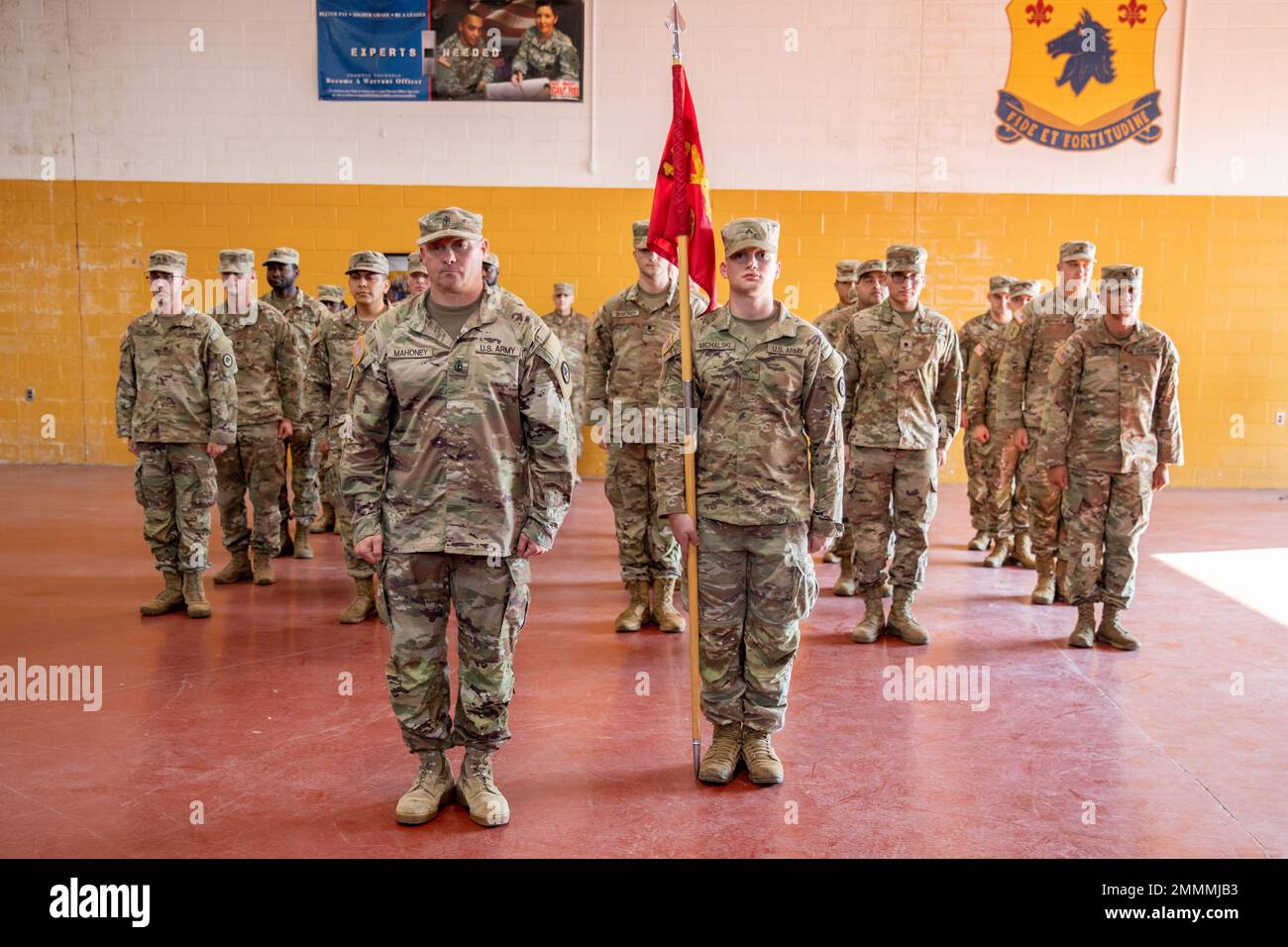 U.S. Army Soldiers with Bravo Battery, 3rd Battalion, 112th Field Artillery Regiment, stand at ...