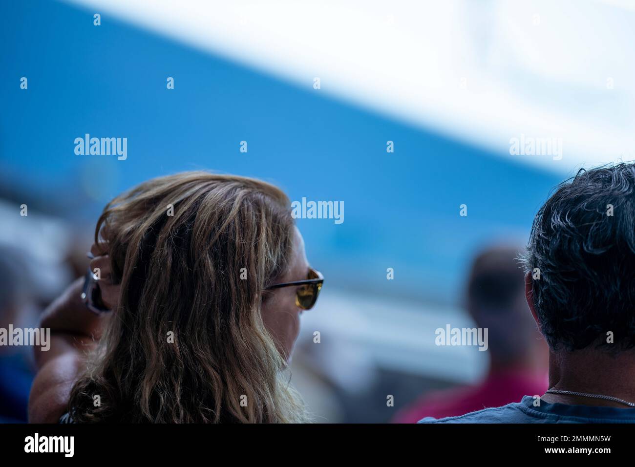 crowds watching a female Professional athlete Tennis player playing on ...