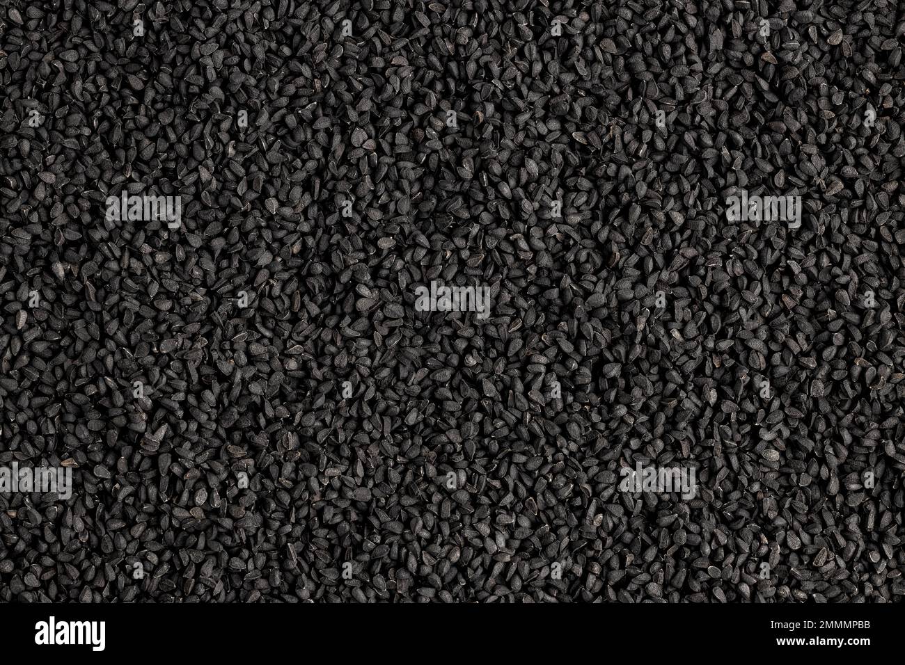 black cumin seeds as background top view Stock Photo - Alamy