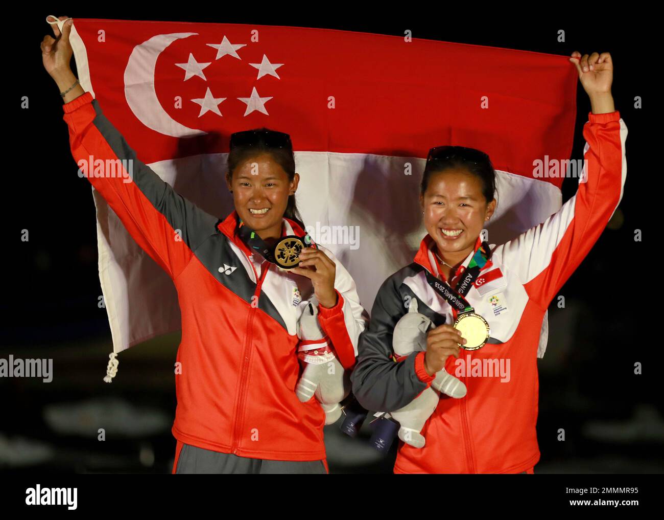 Lim Min Kimberly and Low Rui Qi Cecilia of Singapore with gold medals as they pose for ...