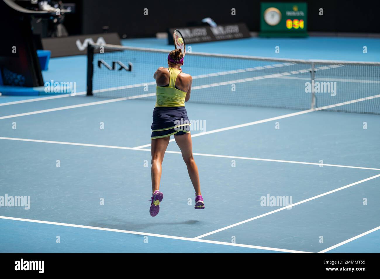 female Professional athlete Tennis player playing on a court in a ...