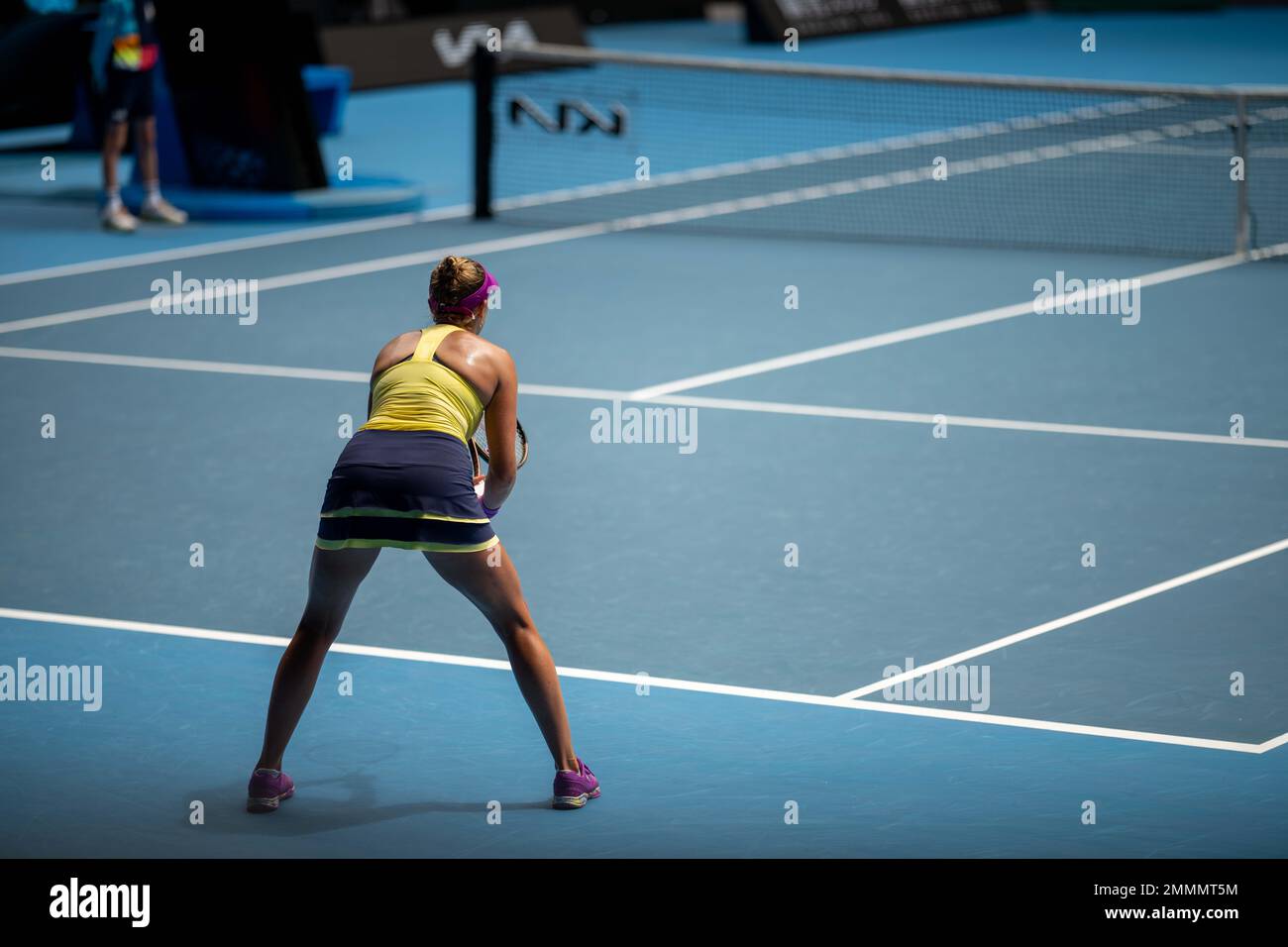 female Professional athlete Tennis player playing on a court in a ...