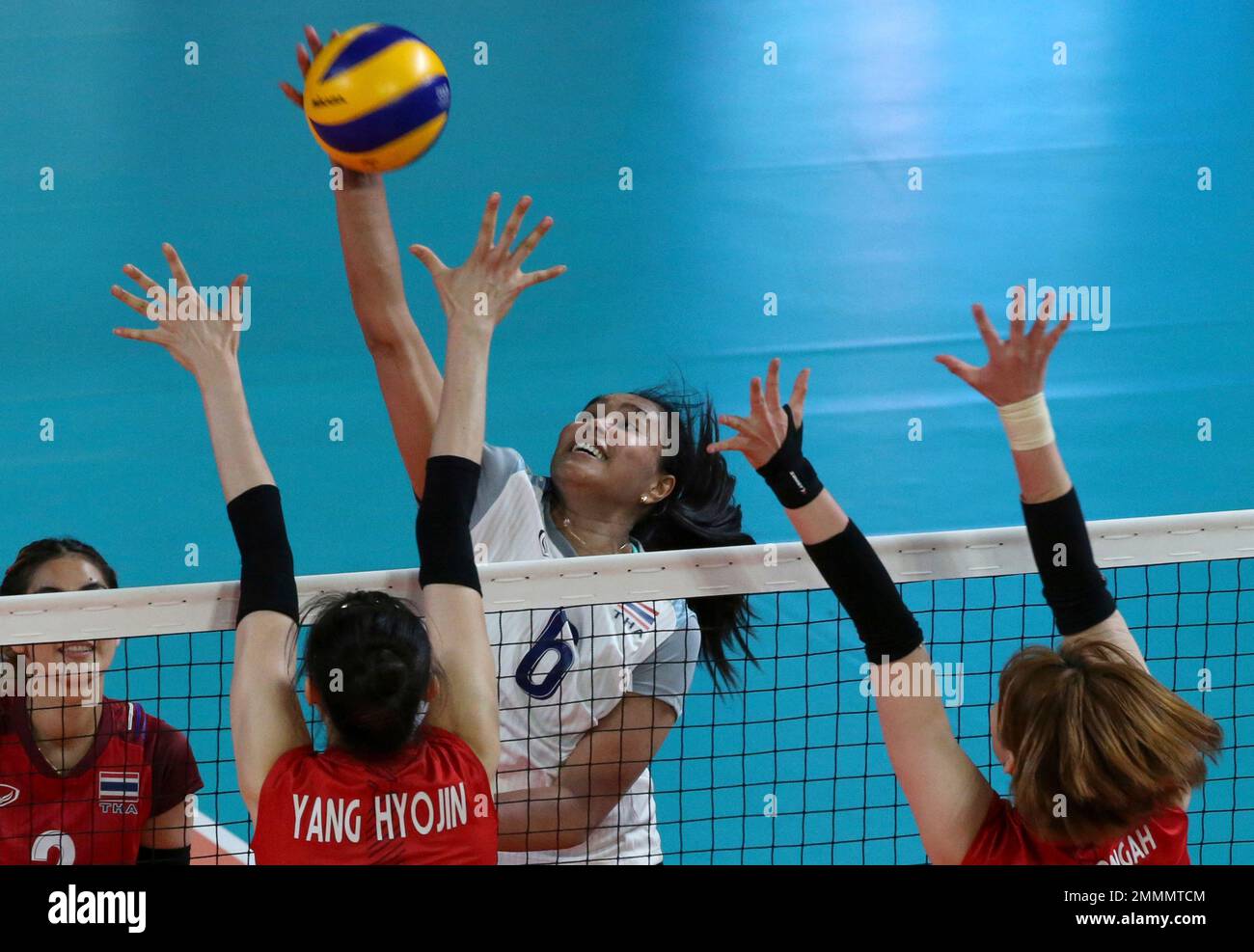 Thailand's Onuma Sittirak spikes against South Korea during the women's ...