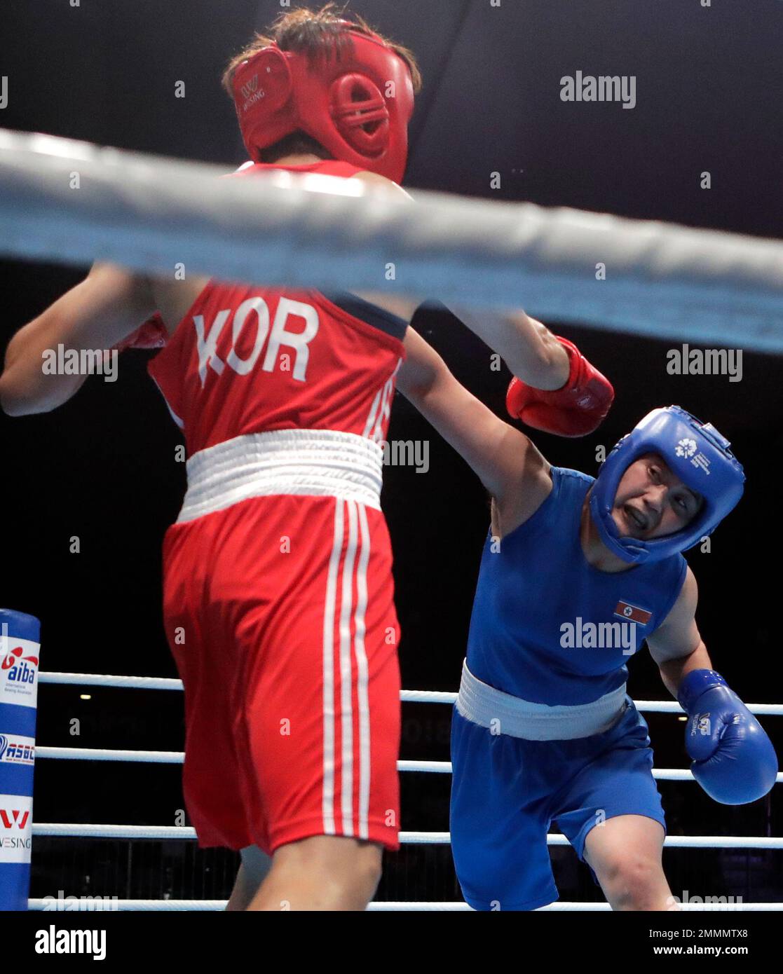 South Korea's Yeonji Oh, red, and North Korea's Hye Song Choe fight in ...