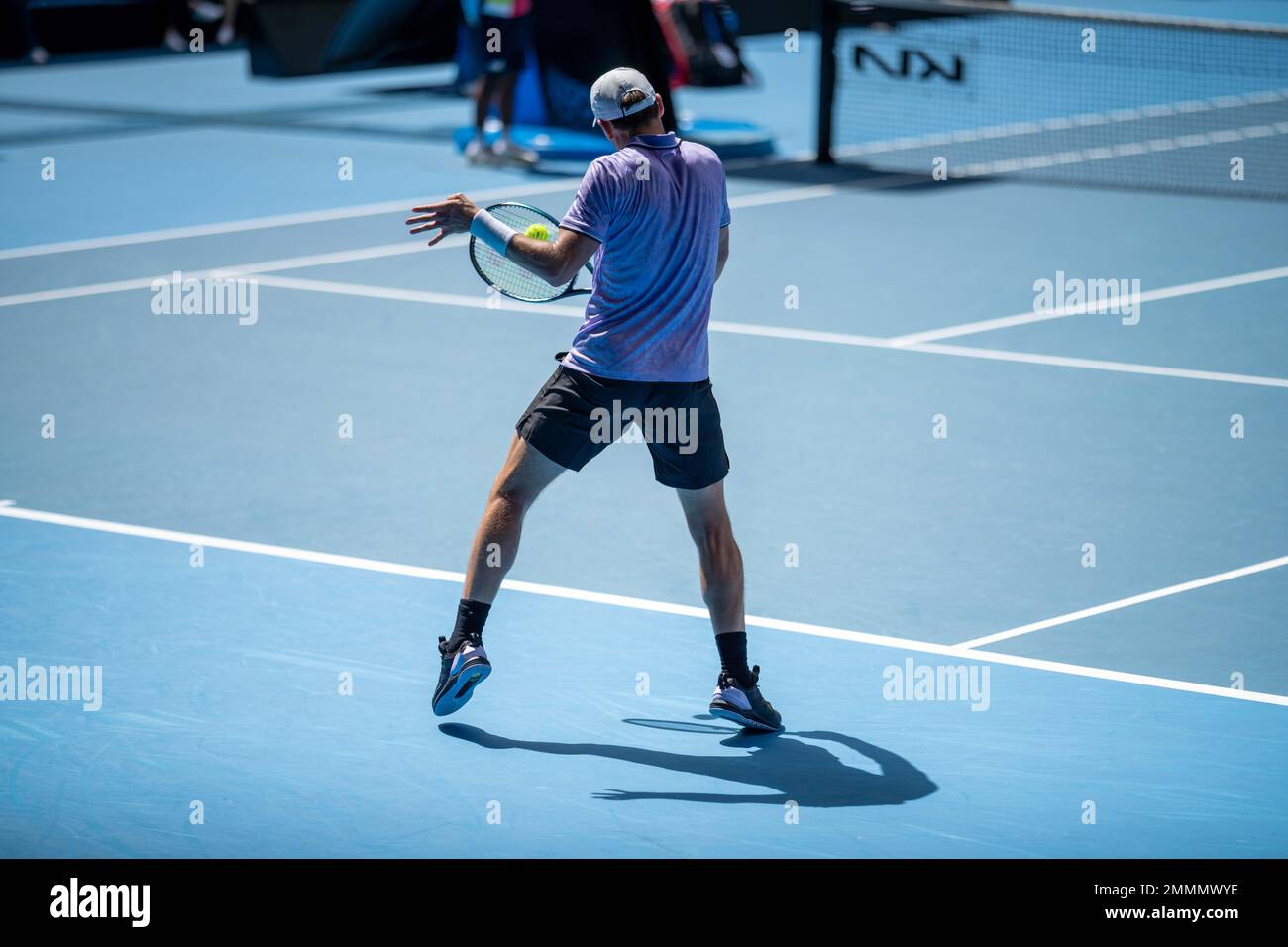 athlete playing tennis. Amateur female tennis player hitting a forehand ...