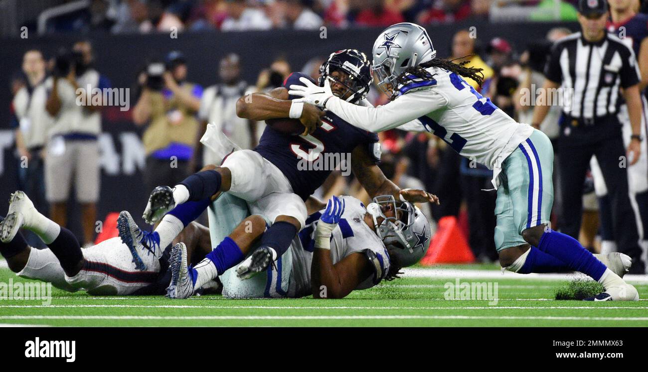 Houston Texans quarterback Joe Webb (5) is sacked by Dallas Cowboys ...