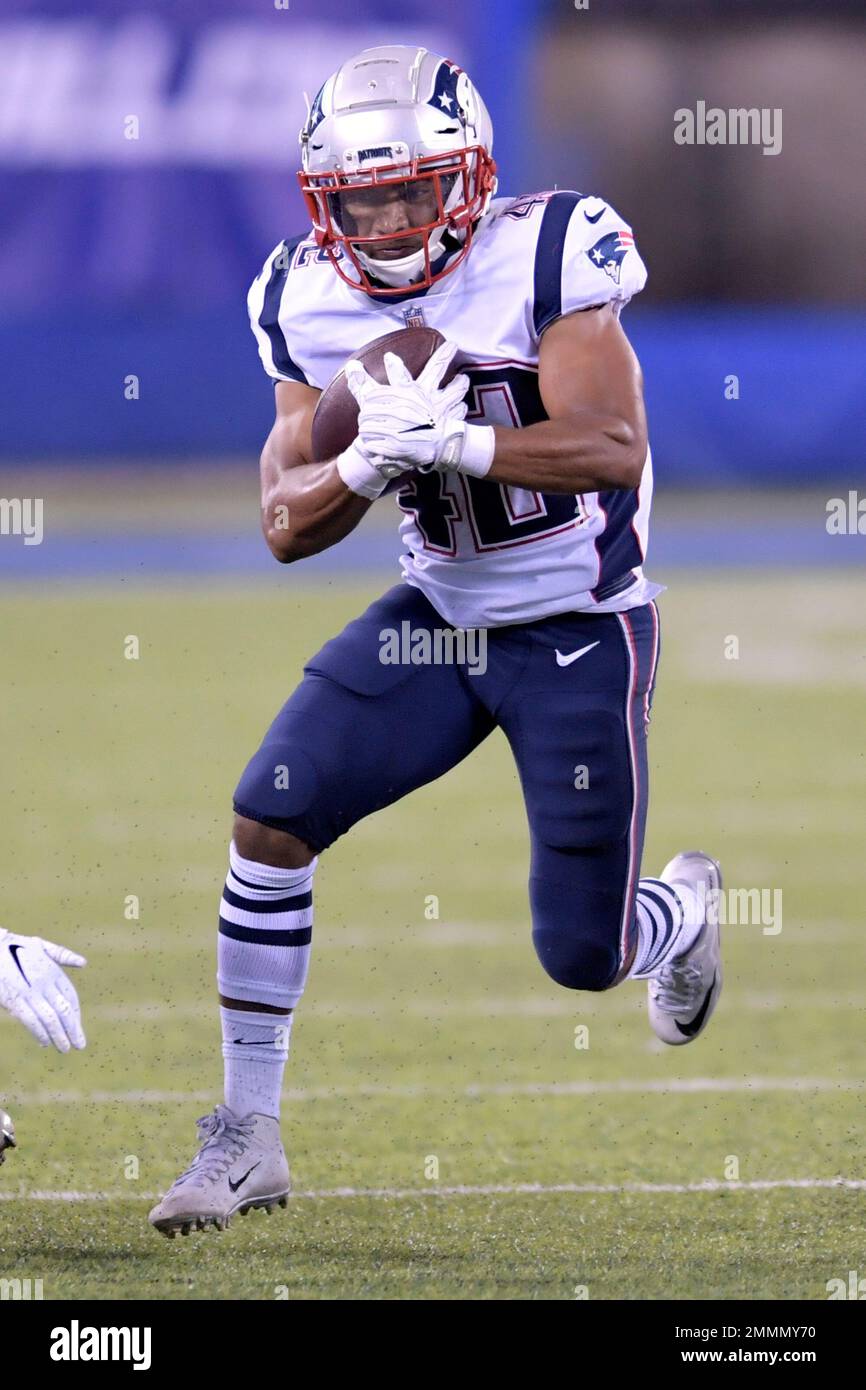 New England Patriots defensive back Duke Dawson runs with the ball ...