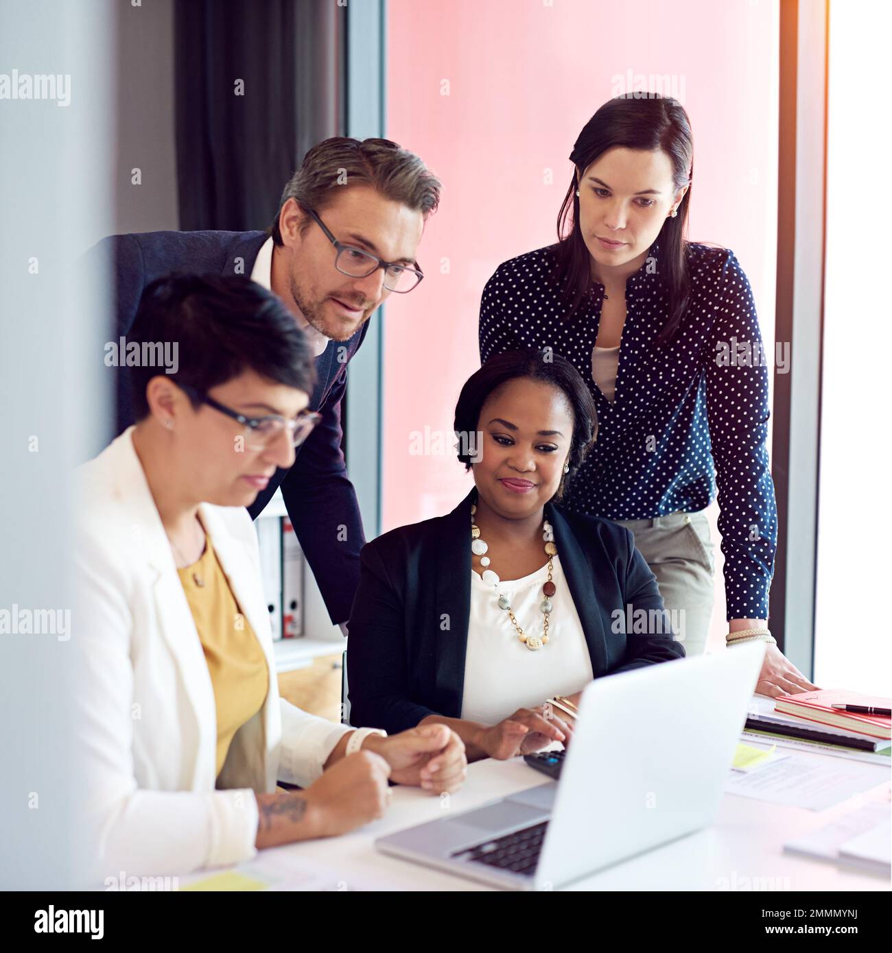 Teamwork is the foundation for success. four business colleagues ...