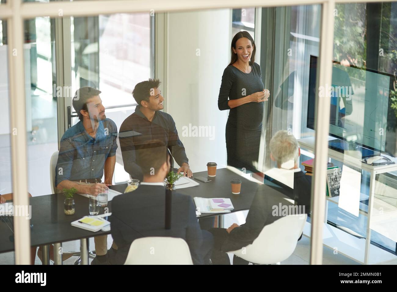 Taking stock and setting new targets. a corporate businessperson giving ...