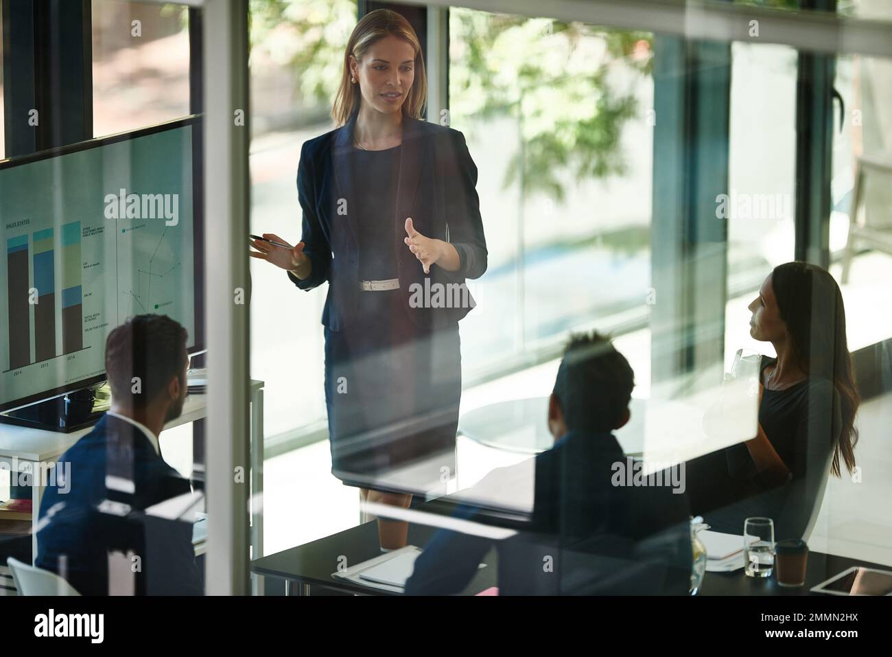 Taking stock and setting new targets. a corporate businessperson giving ...