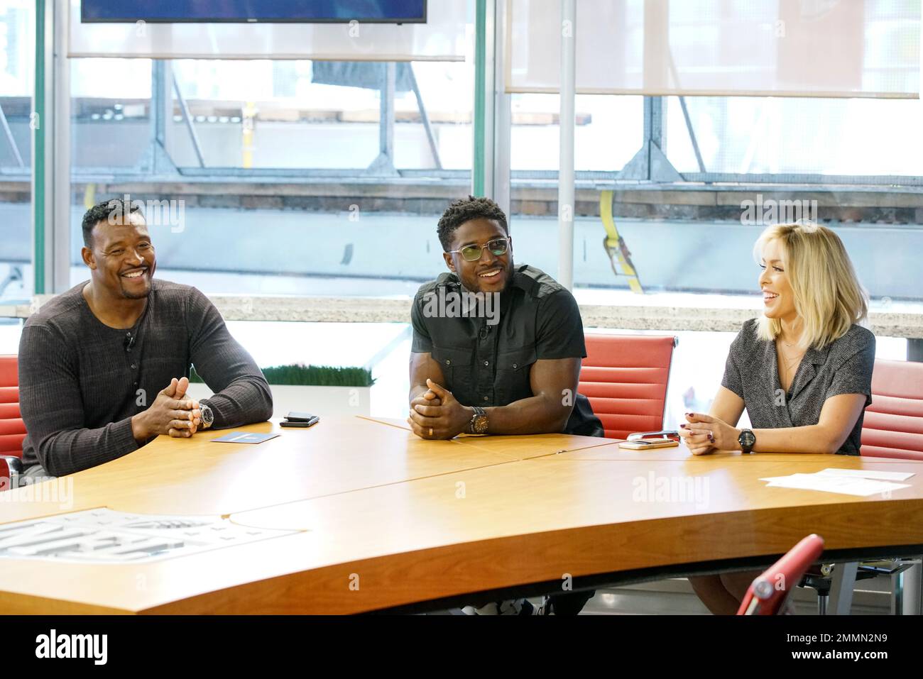 (L - R) NFL Network analysts Willie McGinest, Reggie Bush, and host ...