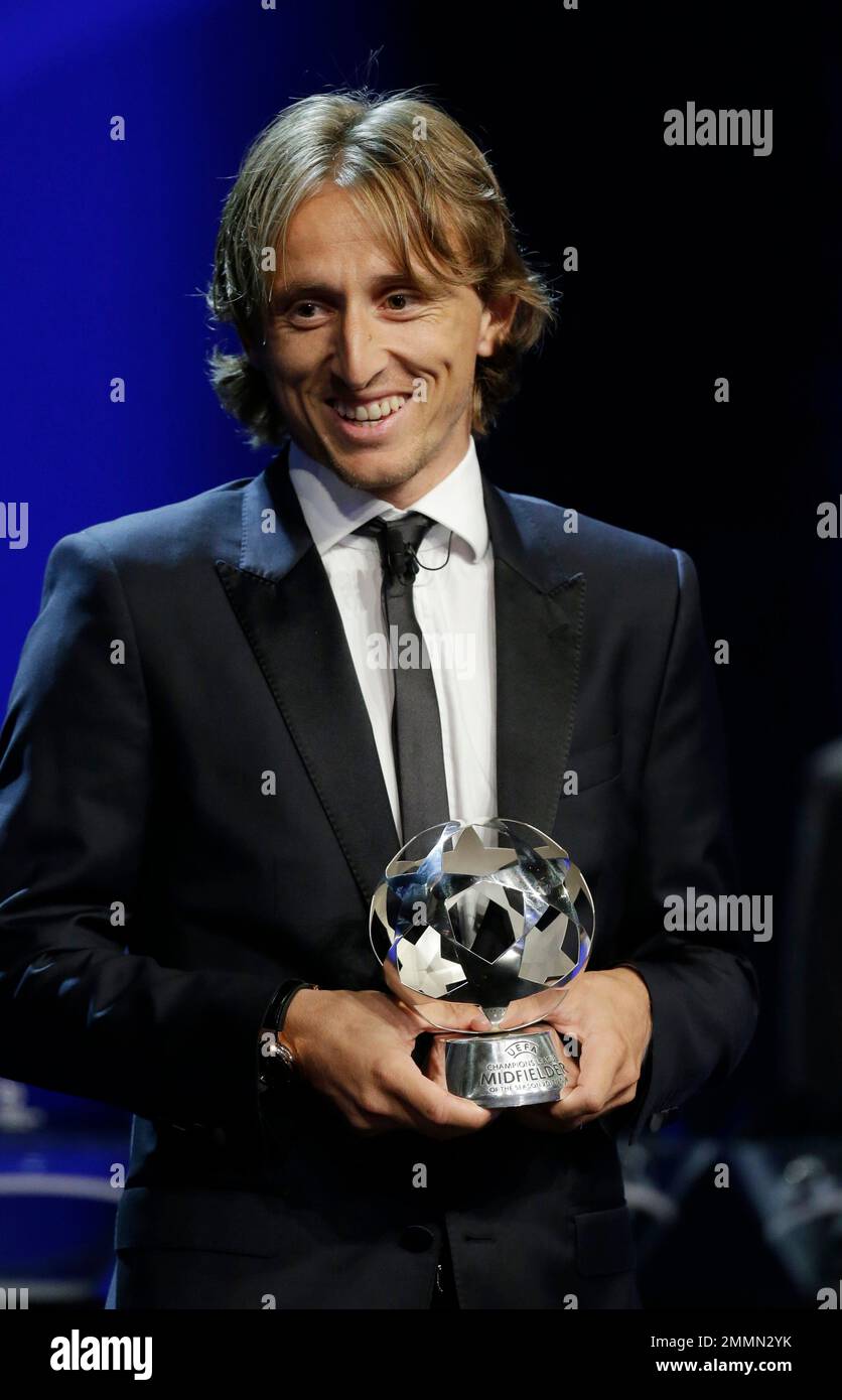 Luka Modric holds his UEFA Champions League Midfielder of the Season ...