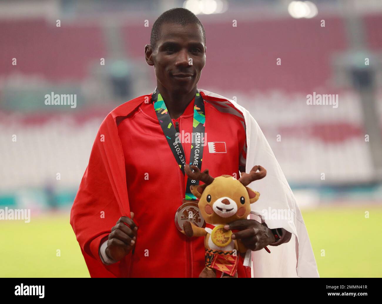 Men's 5000m silver medalist Bahrain's Albert Rop stands on the podium ...