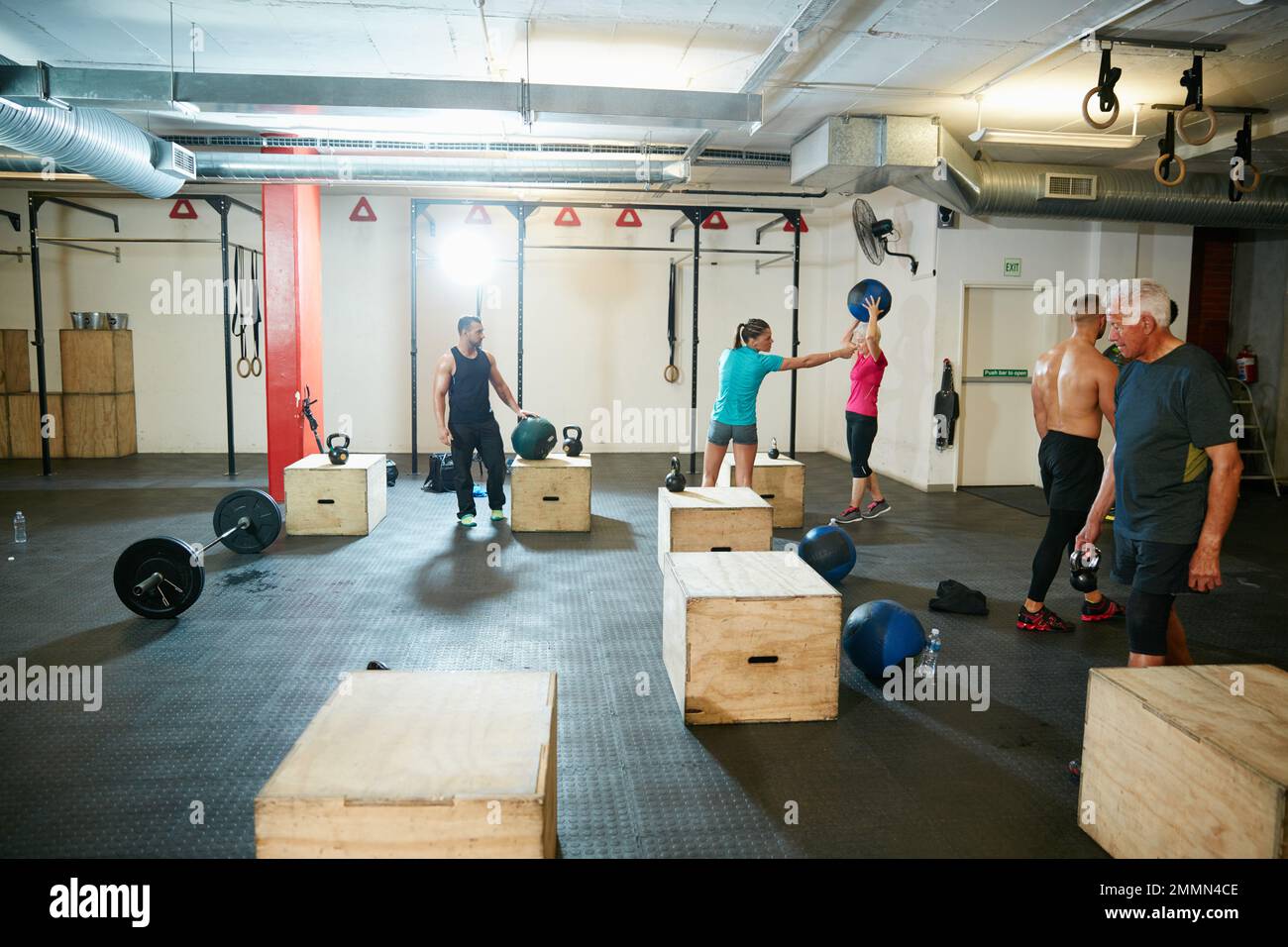 Train with like minded fitness fanatics. a group of people working out ...