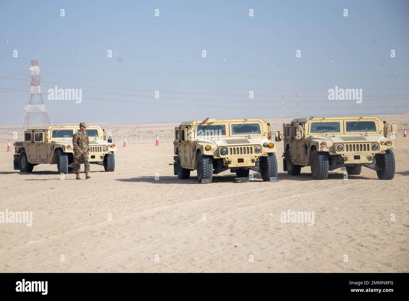 A U.S. Army Soldier with 1st Battalion, 182nd Infantry Regiment guides a vehicle to the motor ...