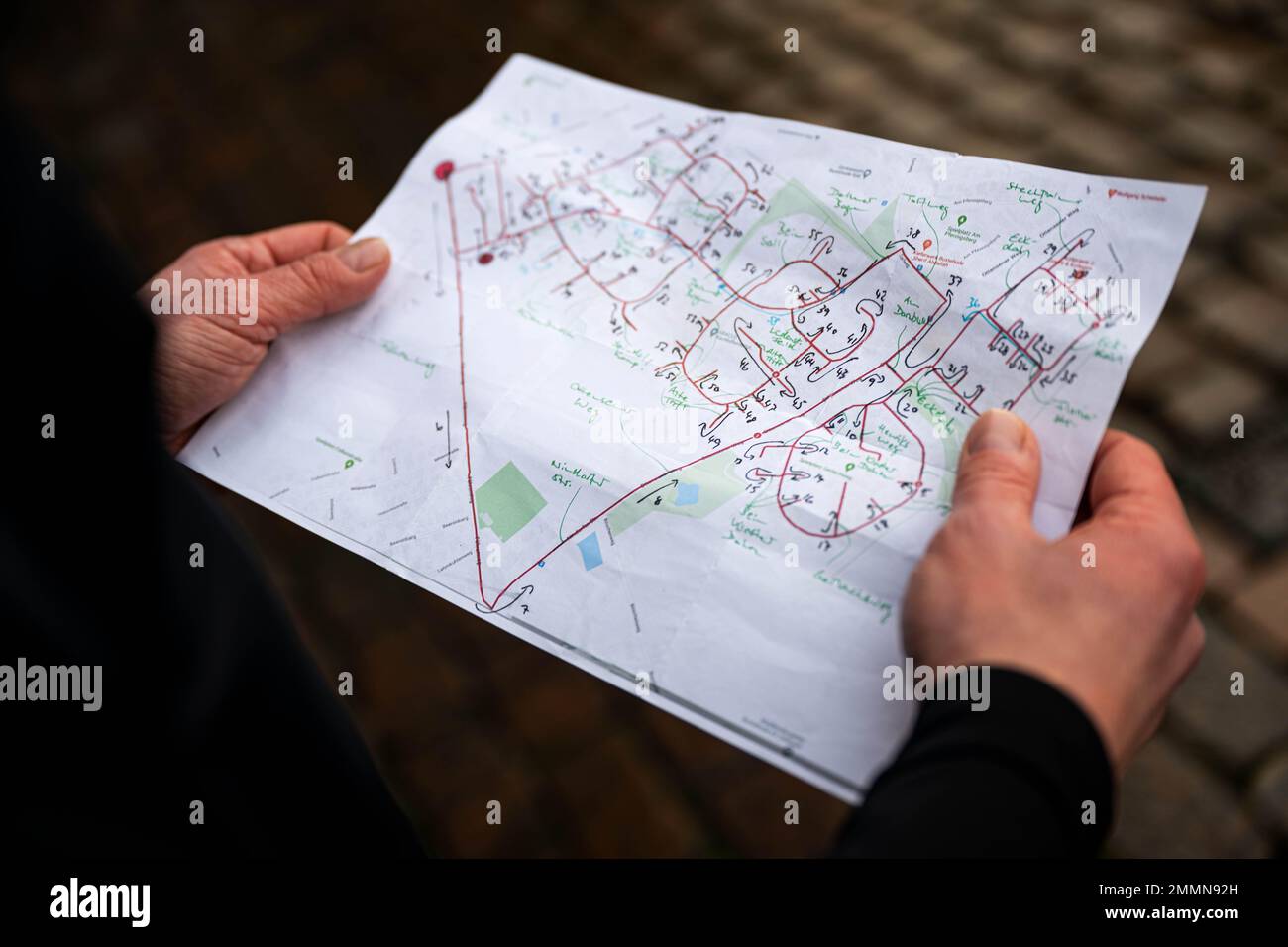 Stade, Germany. 19th Jan, 2023. Mario Krömer shows off his street map ...