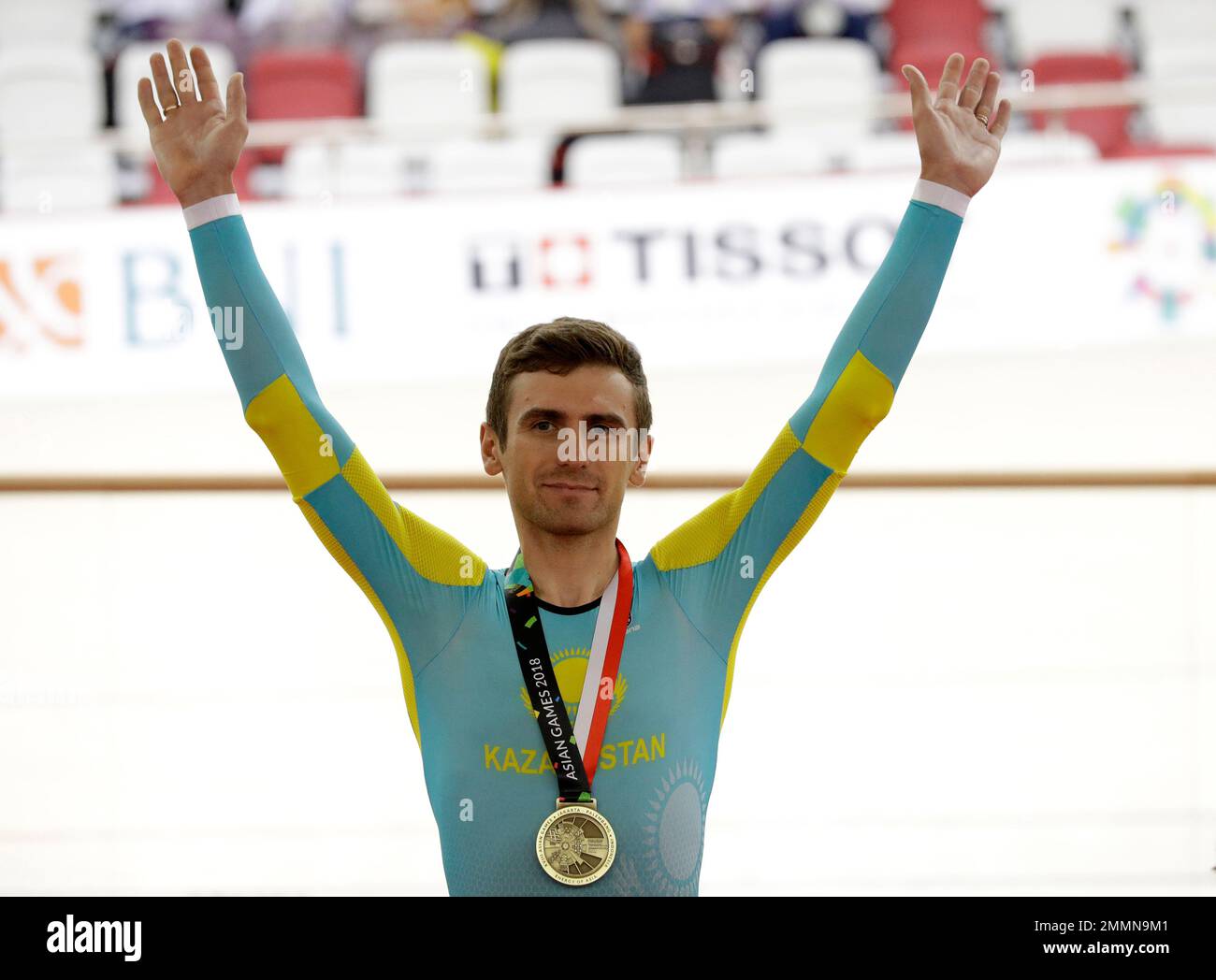 Kazakhstan's Artyom Zakharov celebrates on the podium after winning the ...