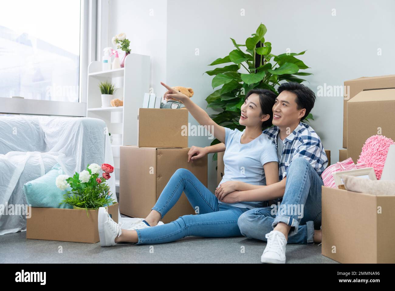 The young couple moved into a new home Stock Photo - Alamy