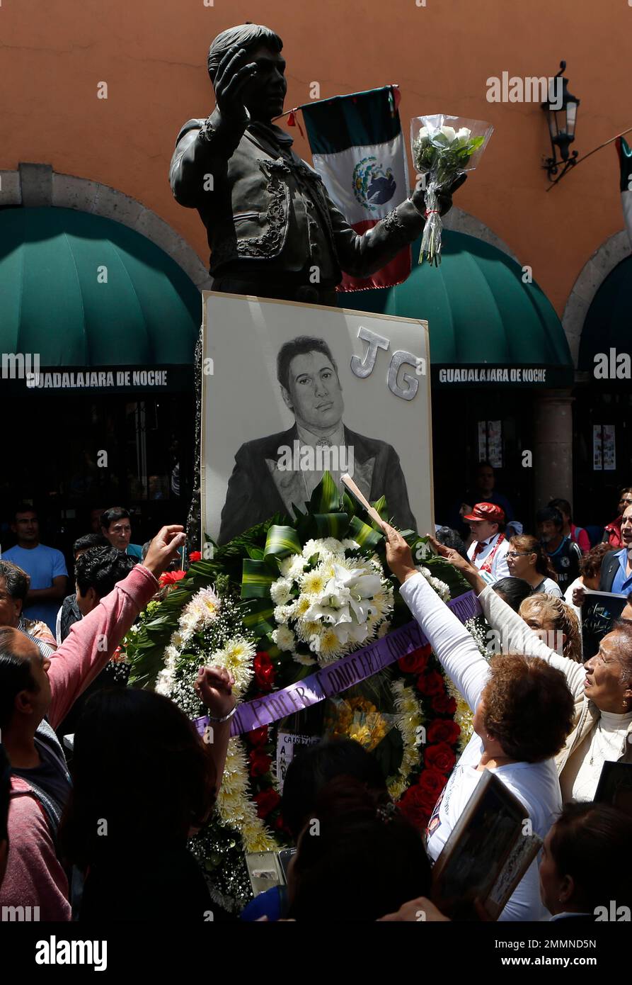 Fans mob a statue of the late Mexican pop star Juan Gabriel in Mexico ...