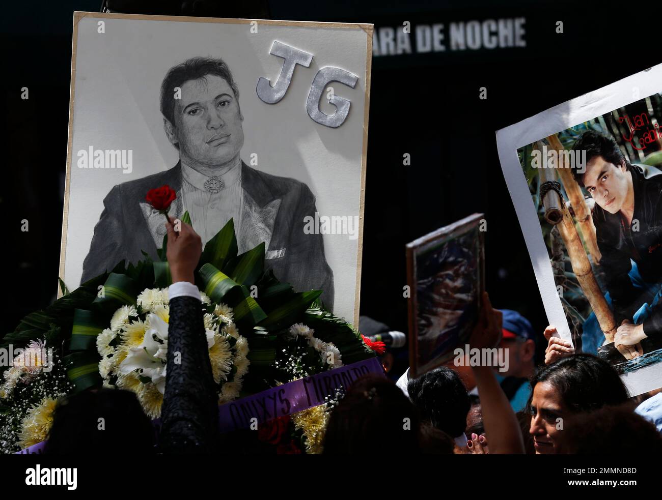 Fans mob a portrait of the late Mexican pop star Juan Gabriel in Mexico ...