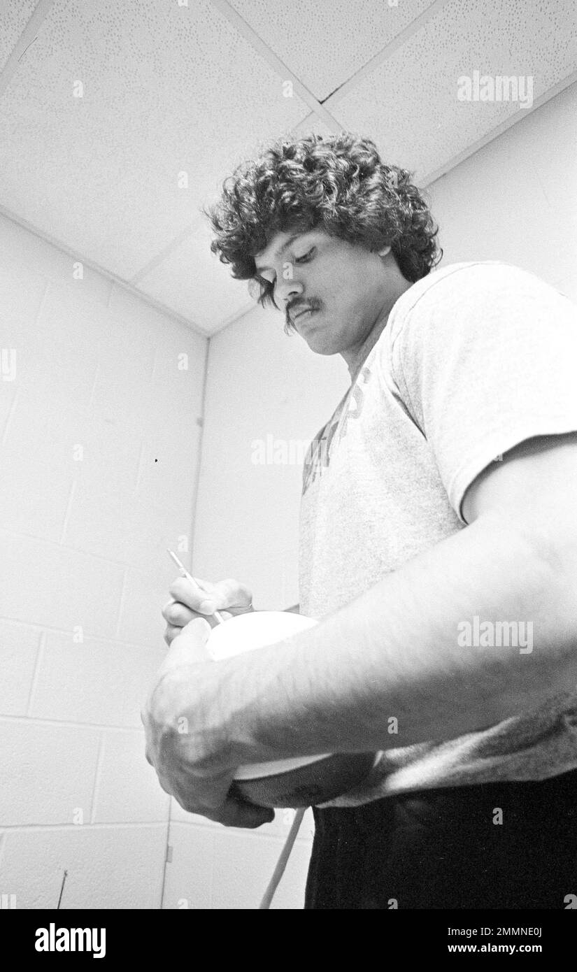 Cincinnati Bengals offensive tackle Anthony Munoz signs a football ...