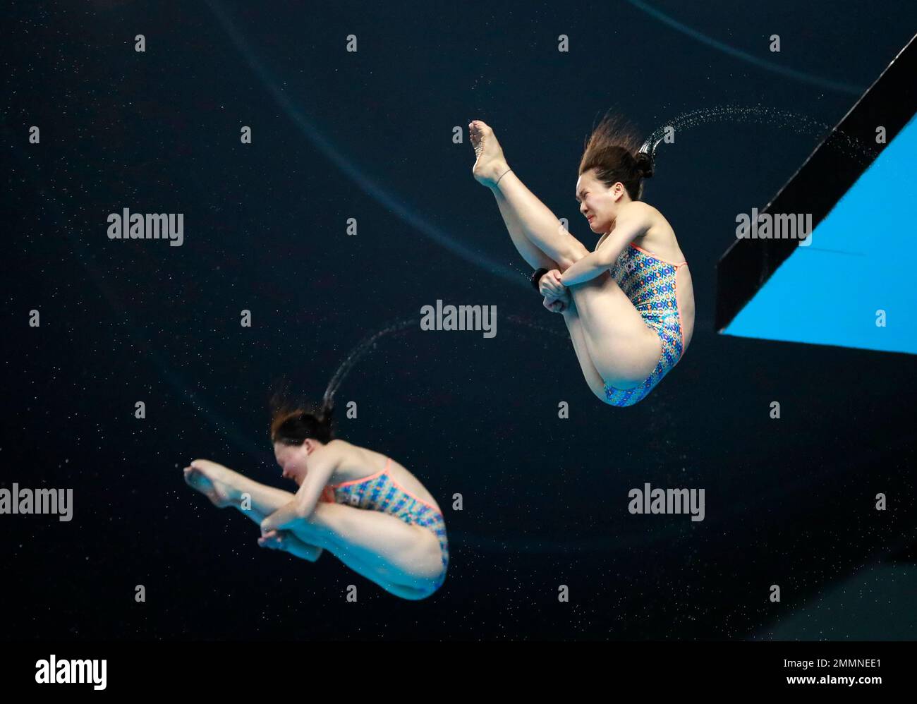 South Korea's Cho Eun-bi and Moon Na-yun compete during women's 10m synchro platform diving ...