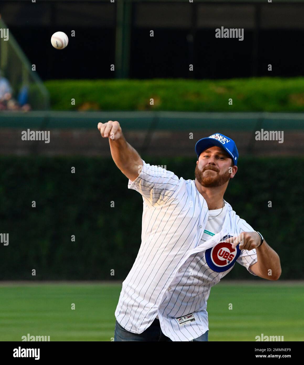 Tyler Reeve throws out a ceremonial first pitch before a baseball game ...