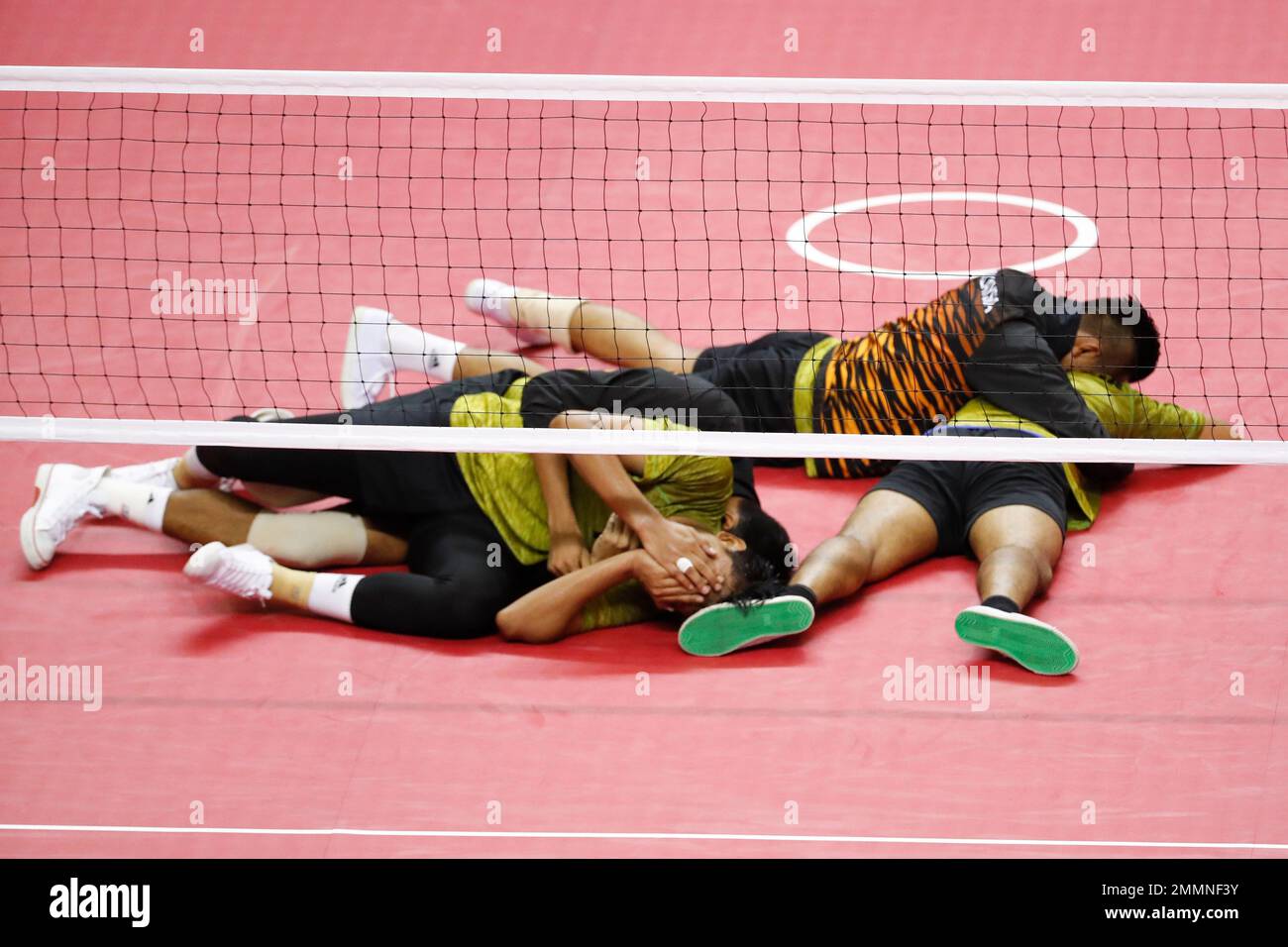 Malaysia's sepak takraw team celebrate after their victory in the men's ...