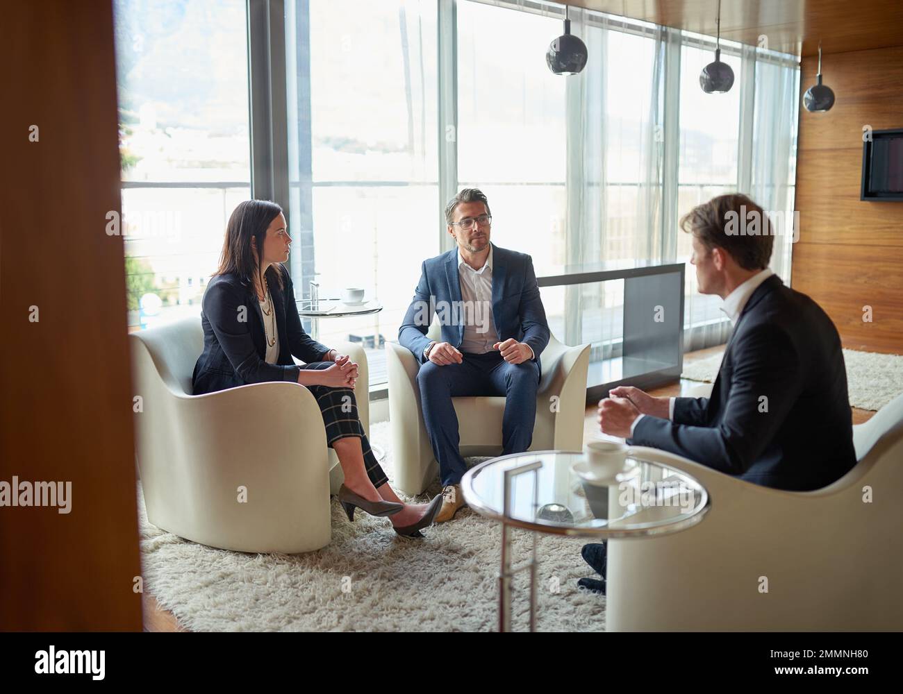 Businessman suit talking group three hi-res stock photography and ...