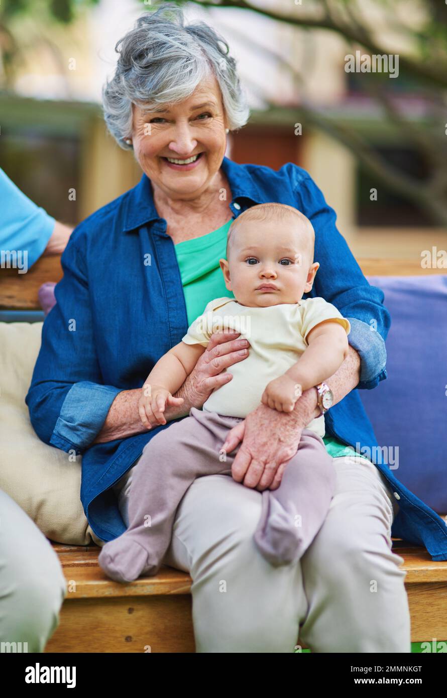 Look at my adorable grandson. a baby boy with his family outdoors Stock ...