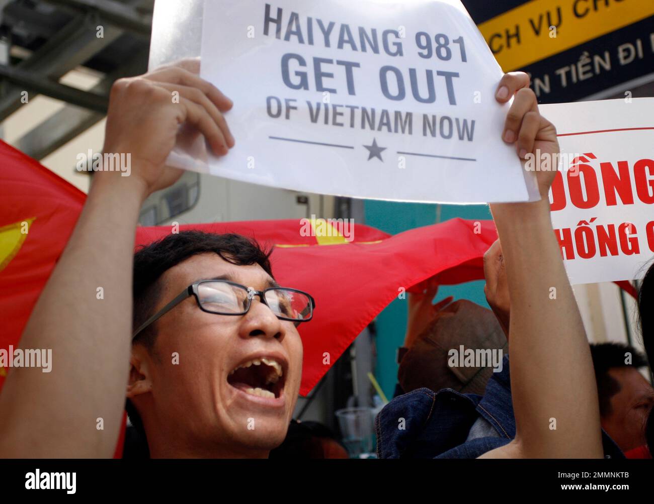 FILE - In this May 10, 2014, file photo, a Vietnamese protester holds ...