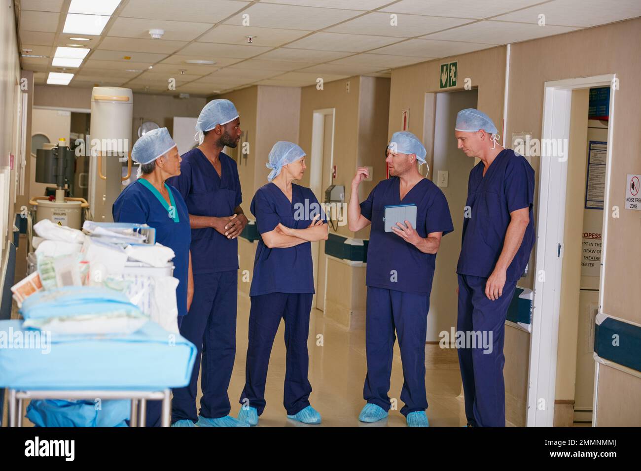 Pooling their medical knowledge. Full length shot of a medical team ...