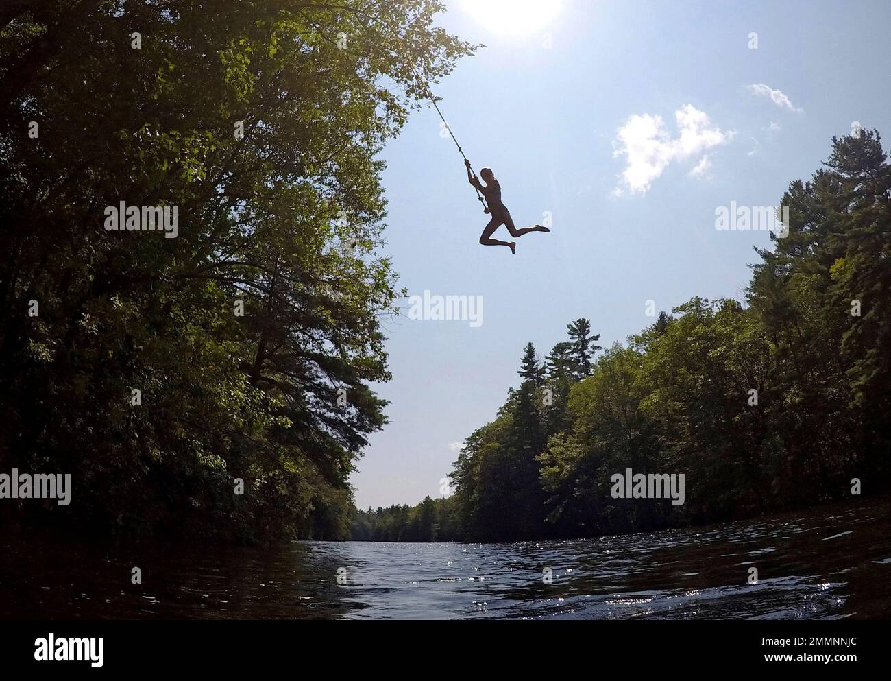 Chloe Warren, 11, of Limington, Maine, sails over the Saco River before ...