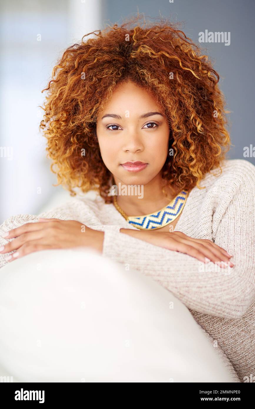 I take my chill time seriously. Portrait of a young woman relaxing at ...