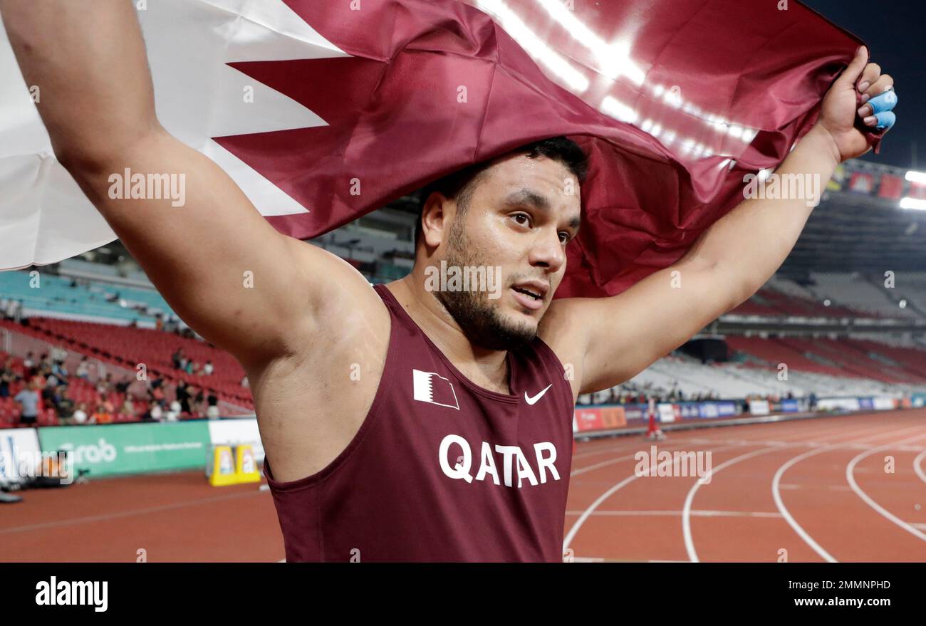 Qatar's Ashraf Elseify celebrates after winning the men's hammer throw ...