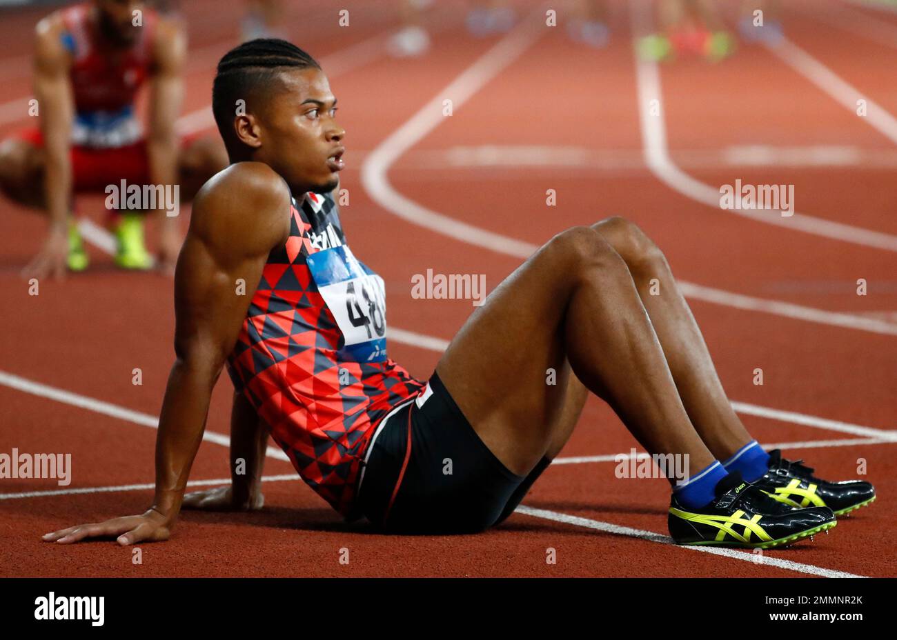 Japan's Julian Walsh rests on the track after his 400m race during the ...