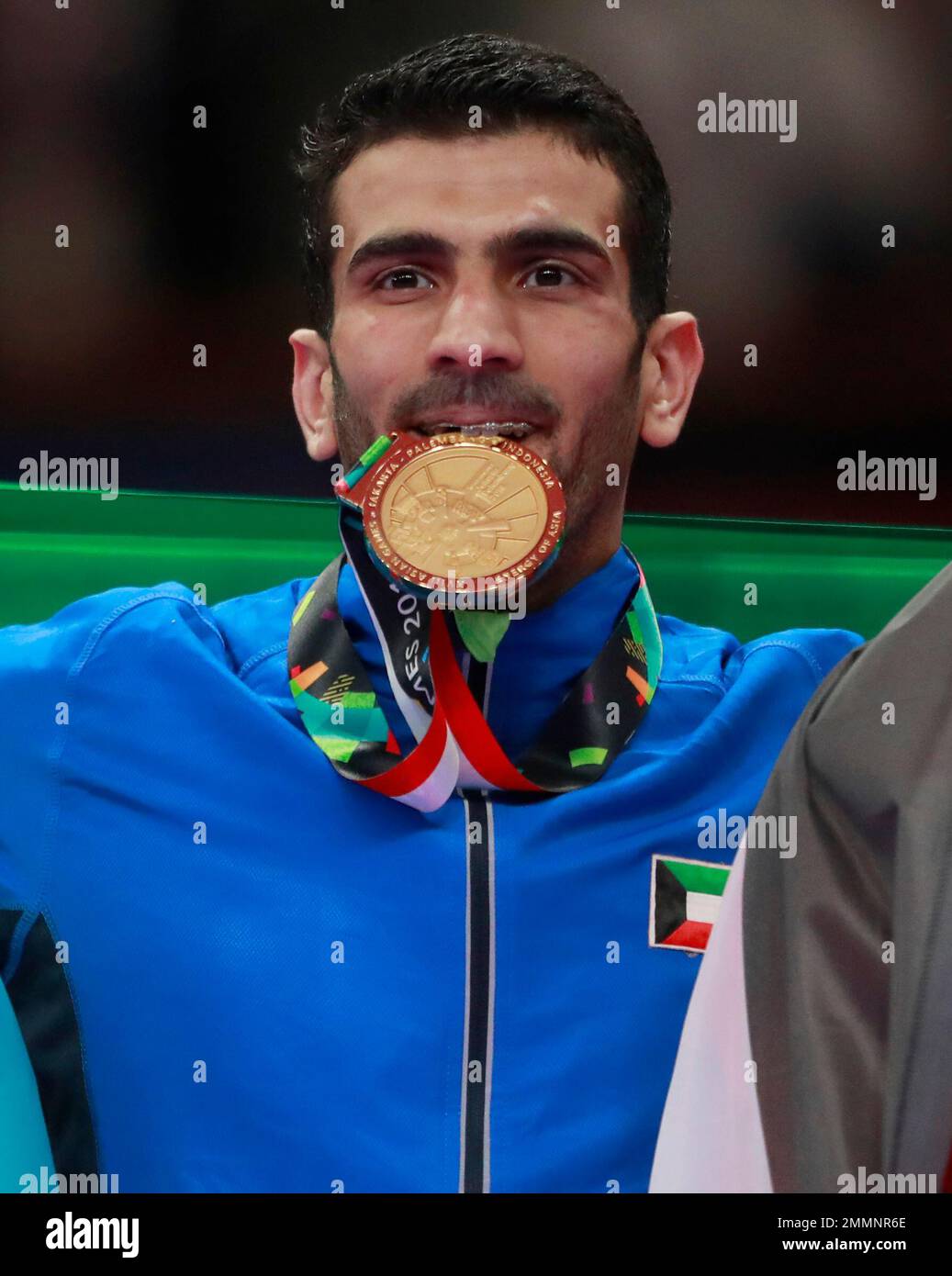 Kuwait's Ali Abdulaziz with medals pose for photographers during the ...