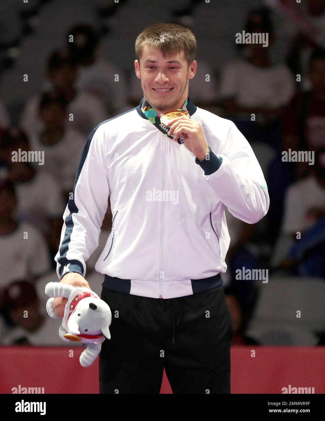 Gold medalist Ruslan Israilov of Kazakhstan poses during the victory ...