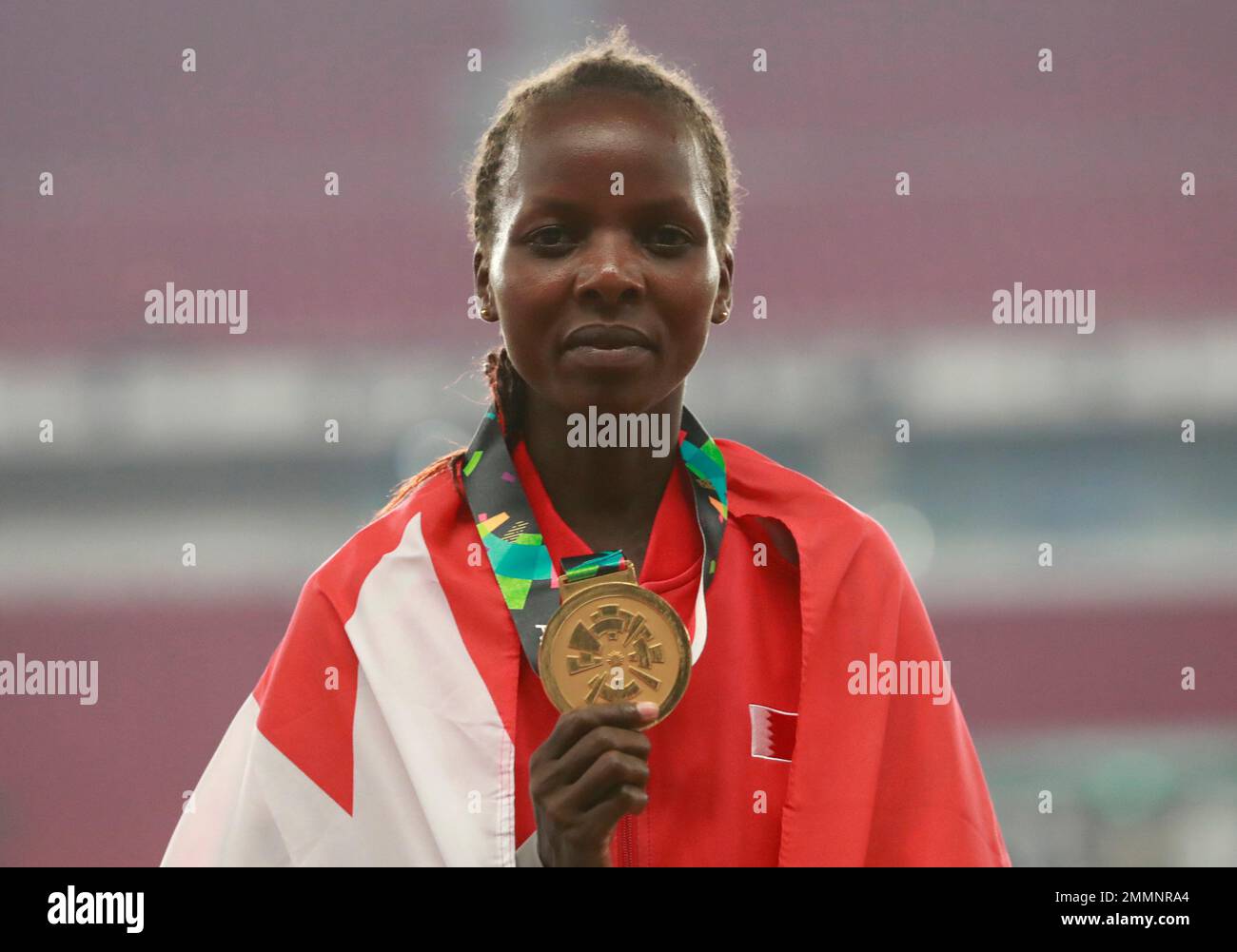 Bahrain's Rose Chelimo holds her gold medal after winning the women's ...